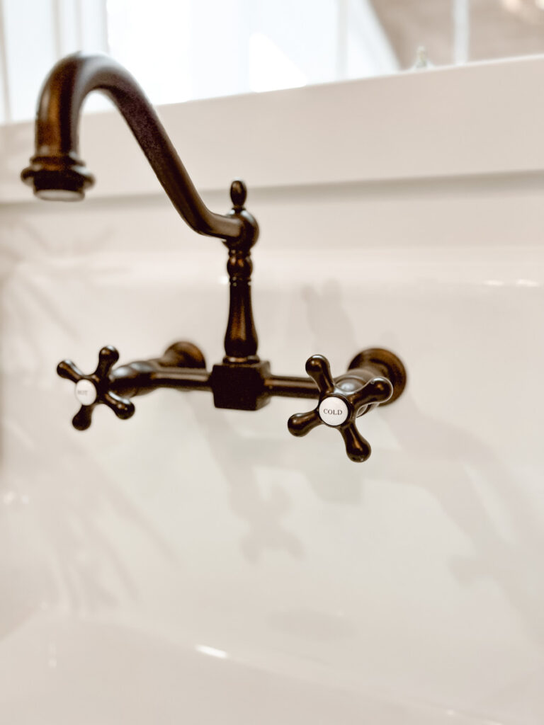 Vintage Looking Laundry Room Sink and Faucet - Deb and Danelle